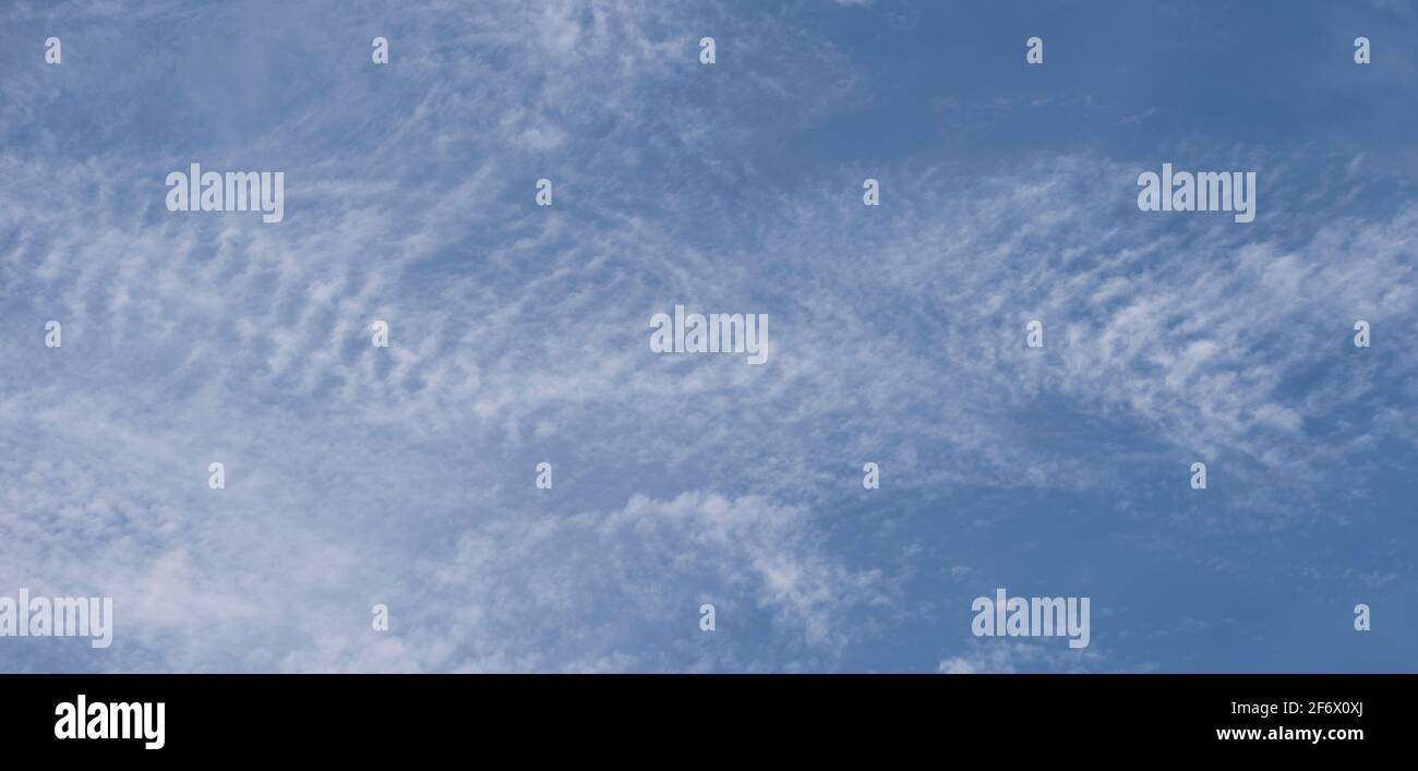 High-altitude cirrocumulus tropospheric clouds. Delicate pattern of ...