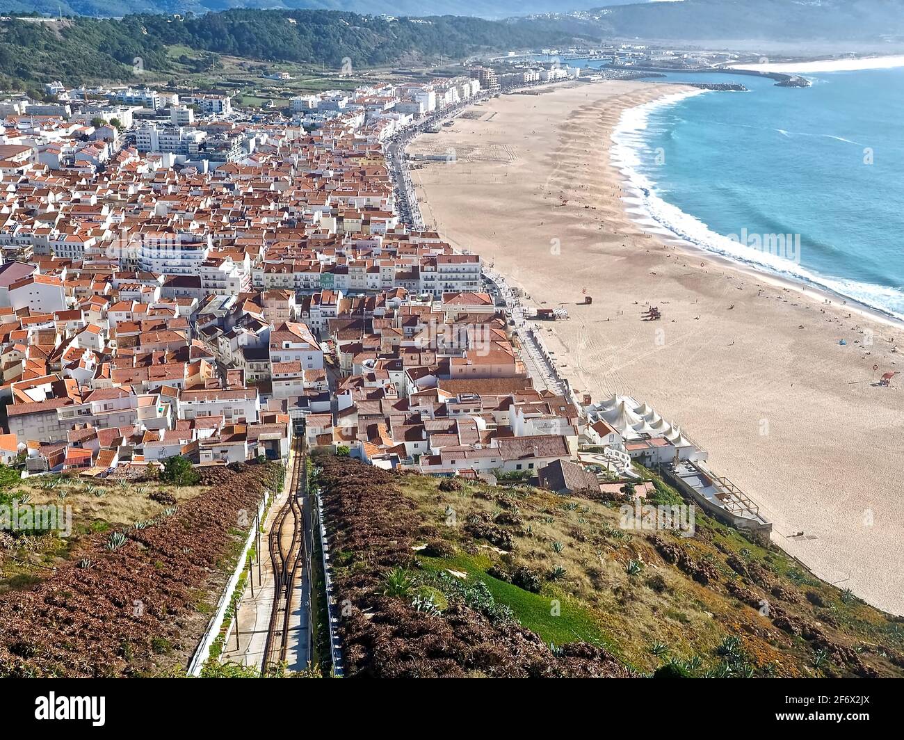Aerial view of Nazare at the Centro coast of Portugal with long beach ...