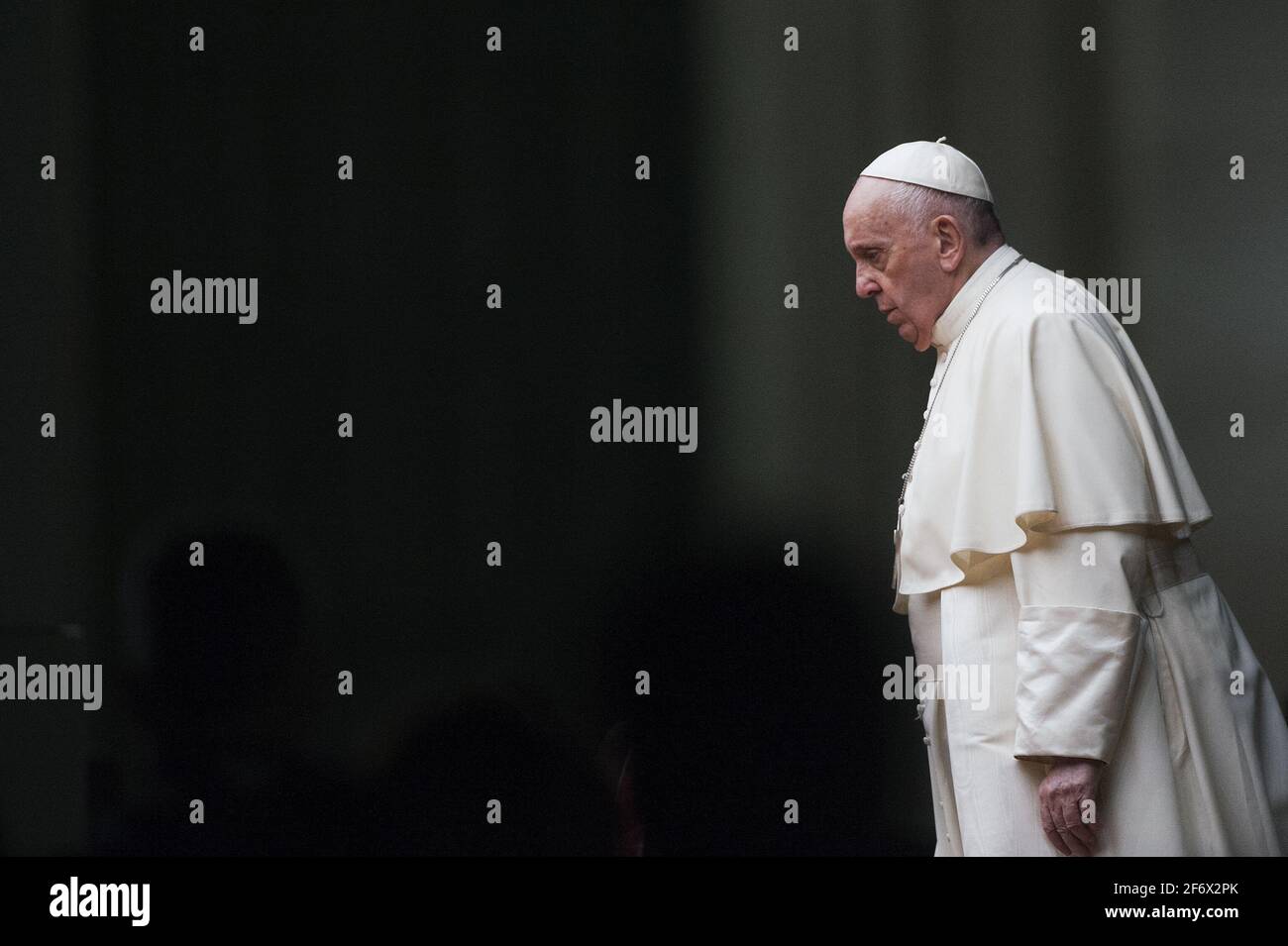 Handout photo - Pope Francis holds the Cross as he leads the ...