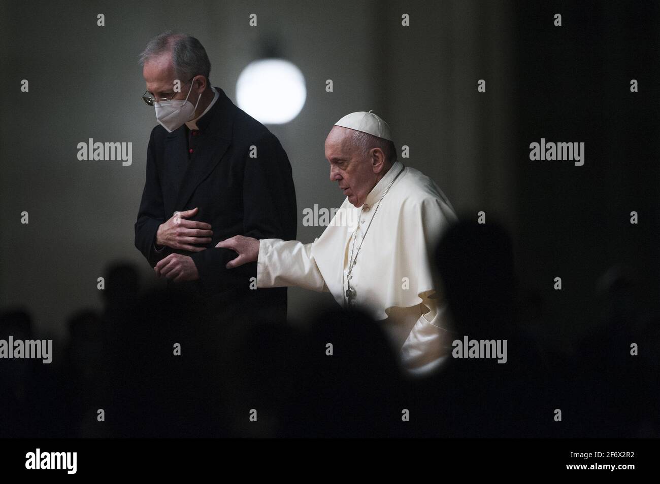 Handout photo - Pope Francis holds the Cross as he leads the ...