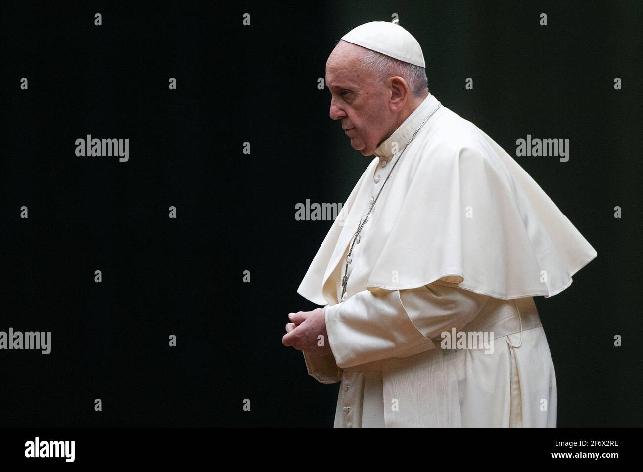 Handout photo - Pope Francis holds the Cross as he leads the ...