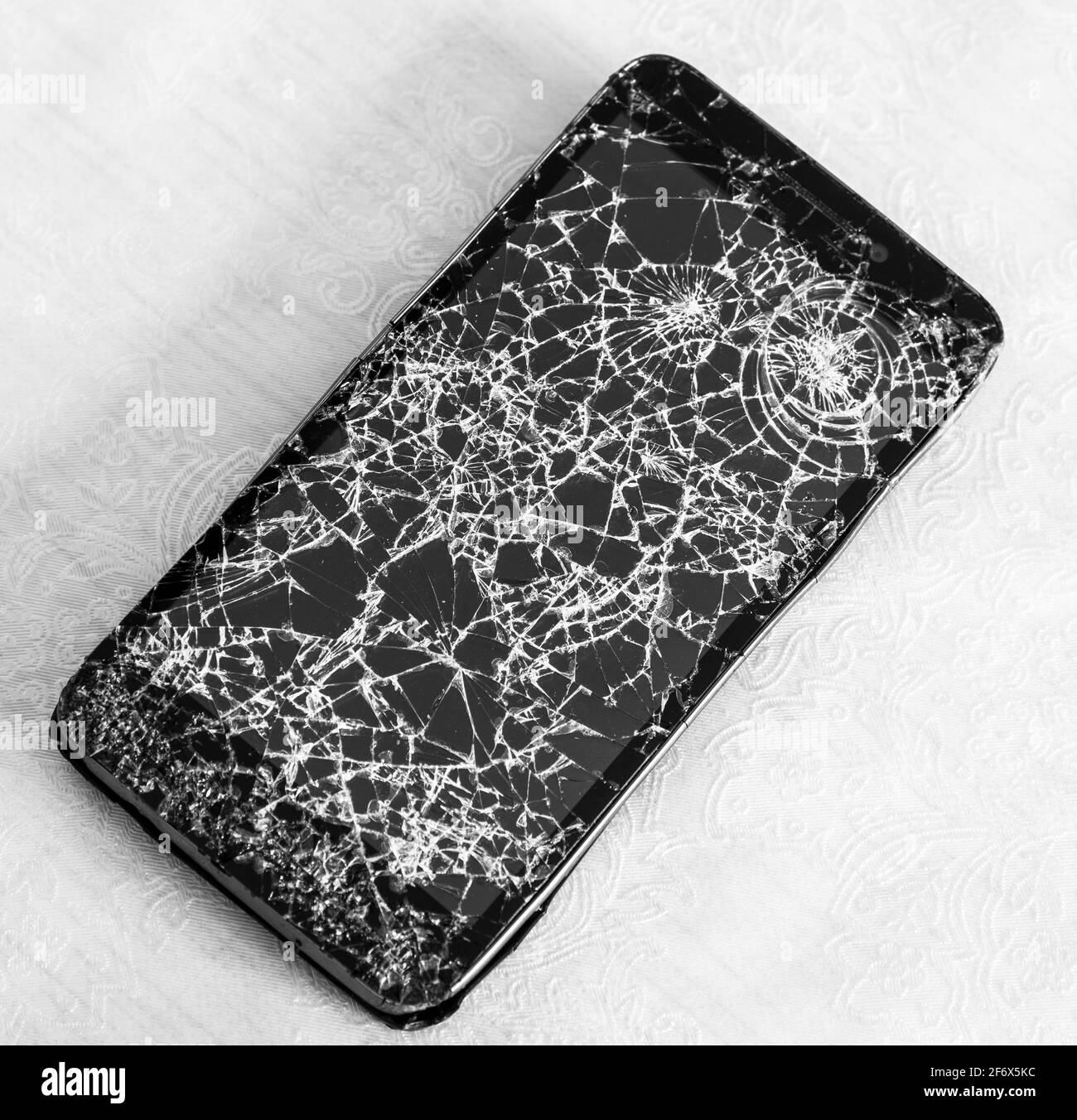 Smartphone with the broken glass screen Stock Photo - Alamy