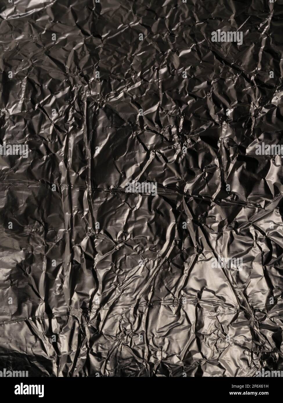 Thin sheet of silver leaf background with shiny uneven surface Stock ...
