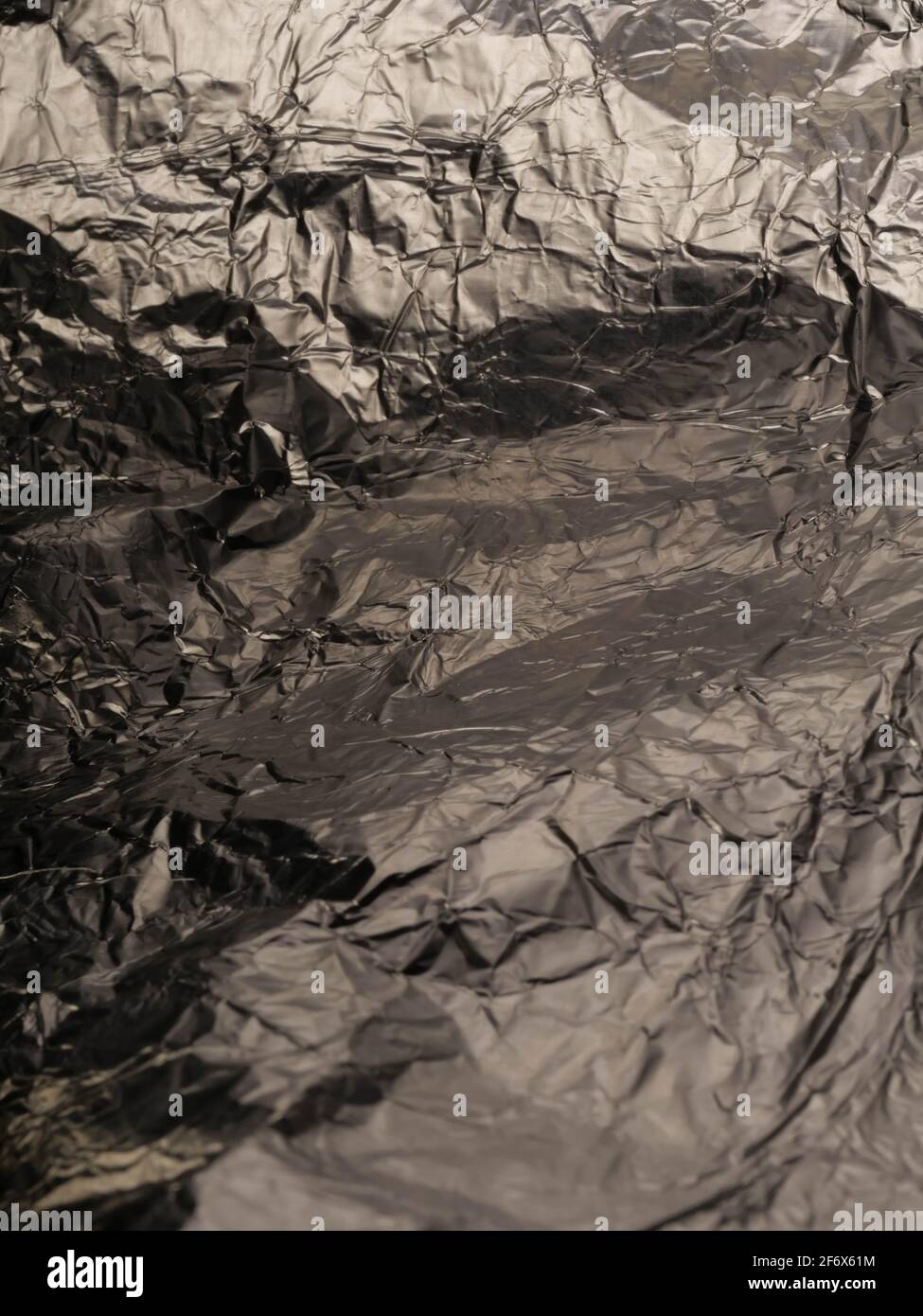 Thin sheet of silver leaf background with shiny uneven surface Stock ...