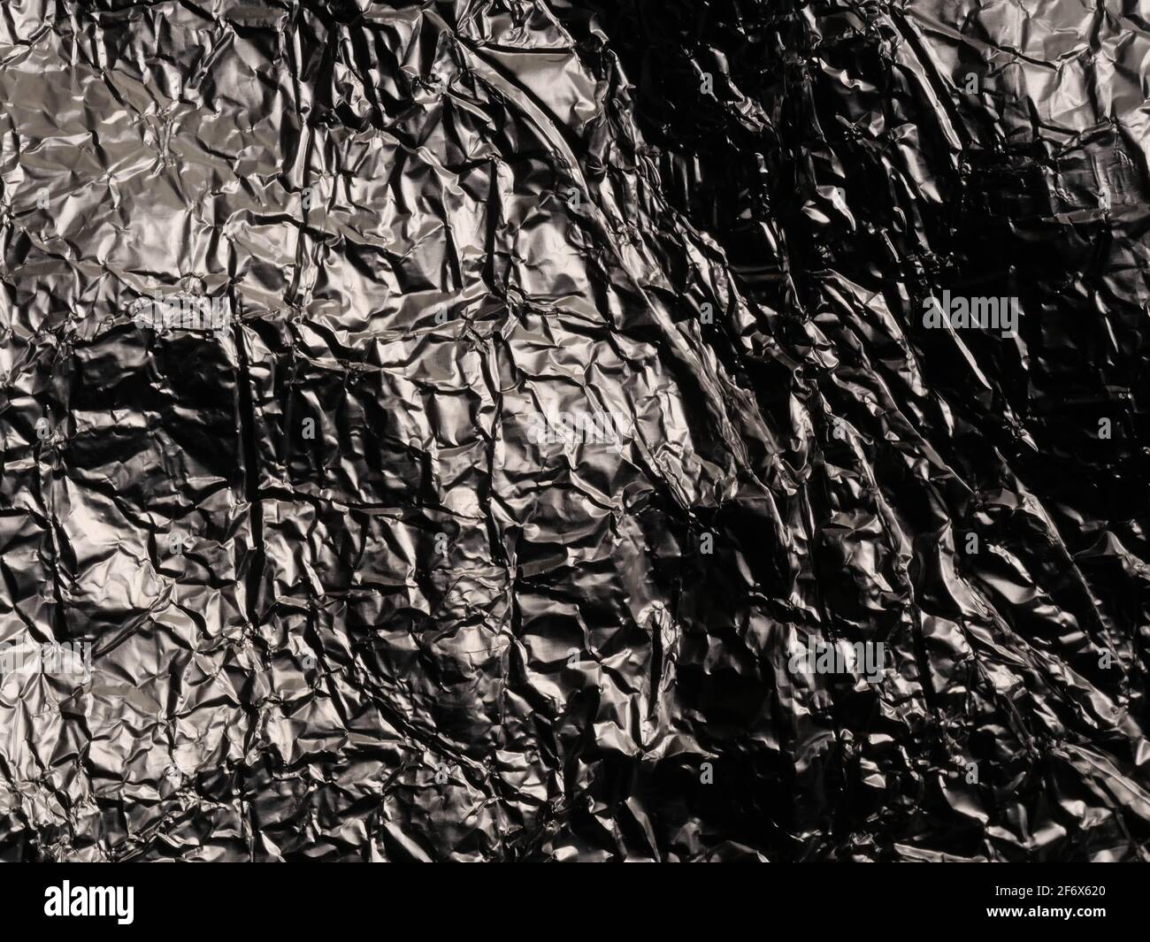 Thin sheet of silver leaf background with shiny uneven surface Stock ...