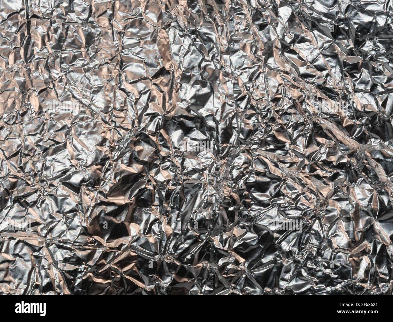 Thin sheet of silver leaf background with shiny uneven surface Stock ...