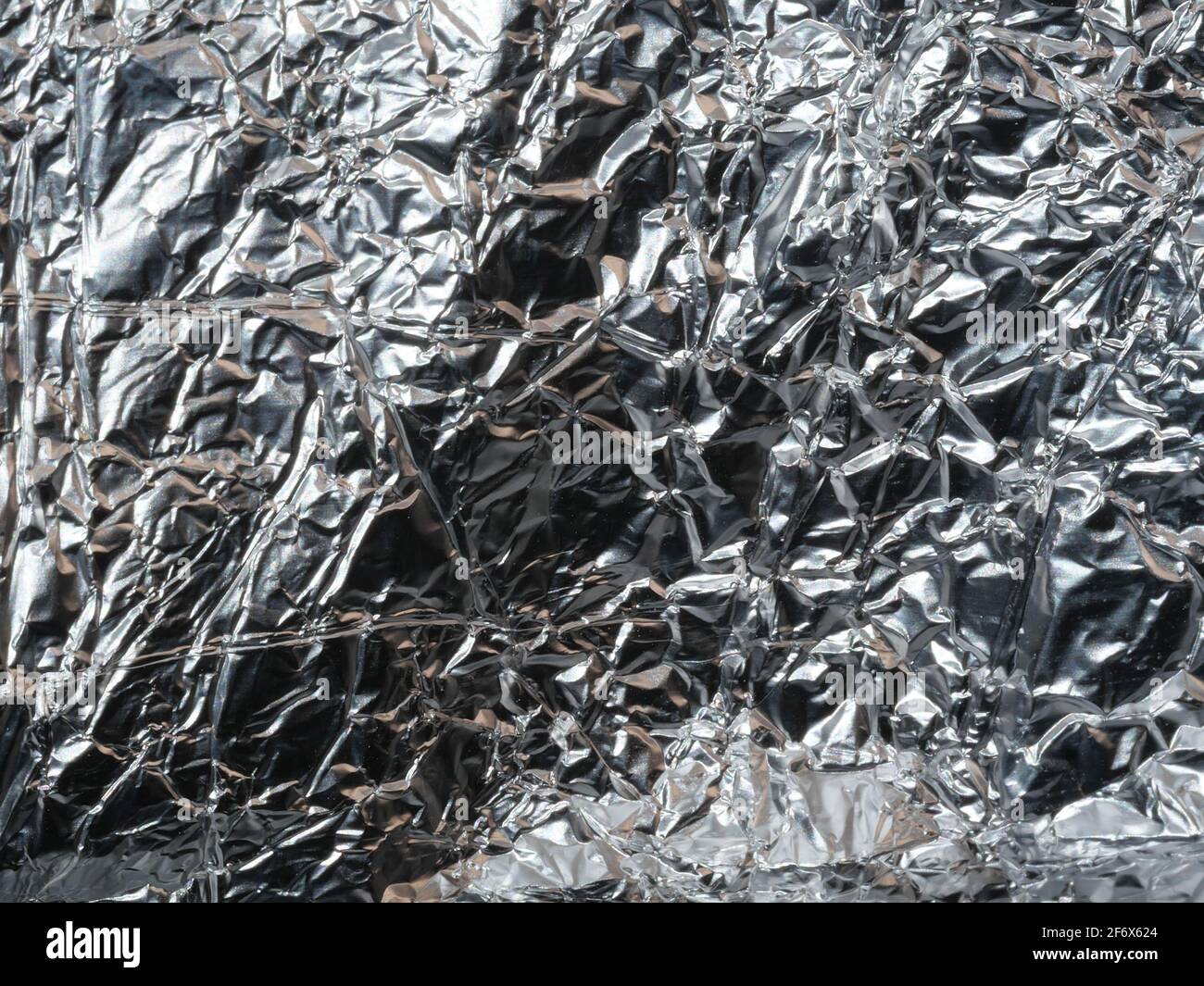 Thin sheet of silver leaf background with shiny uneven surface Stock ...