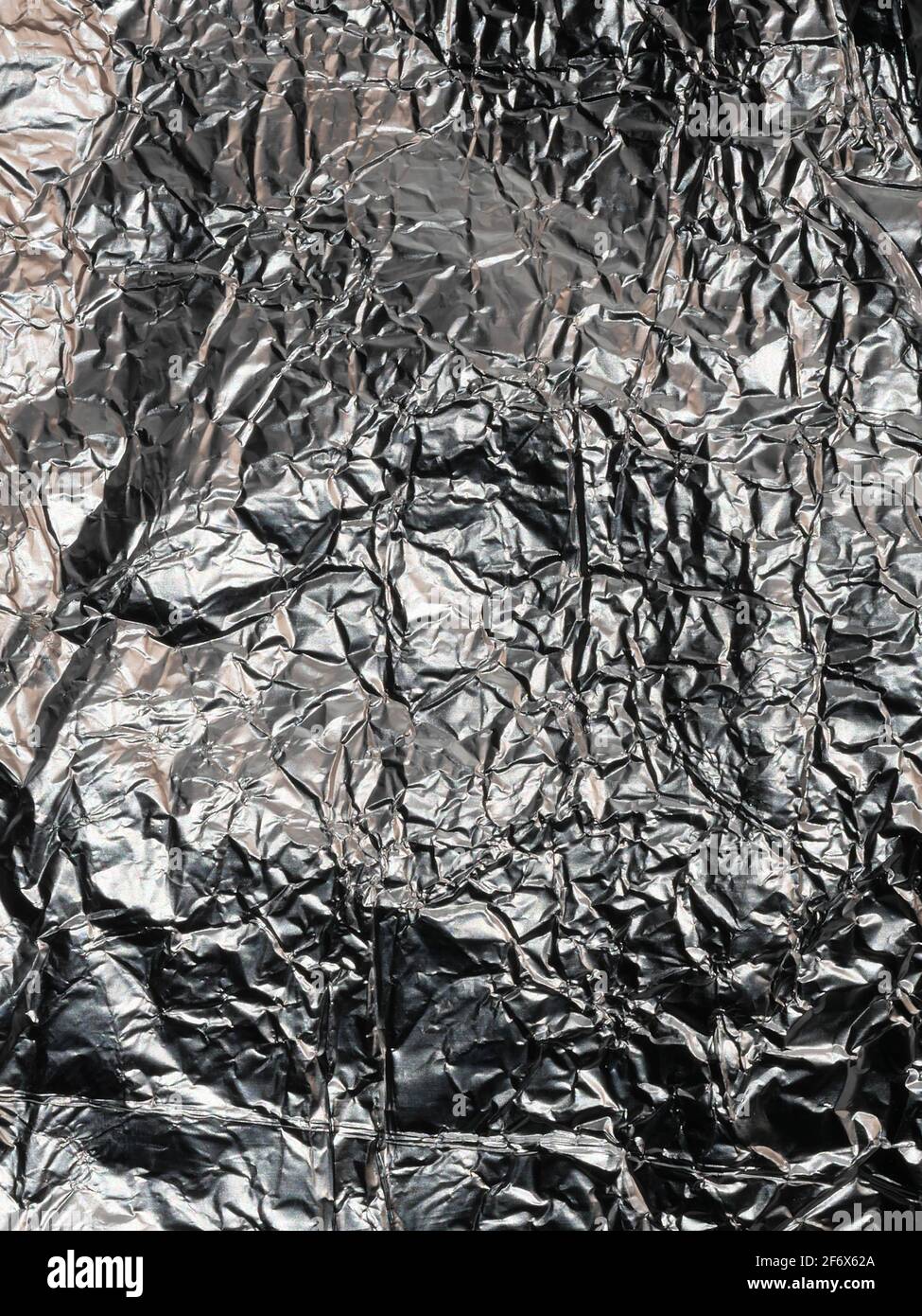 Thin sheet of silver leaf background with shiny uneven surface Stock ...