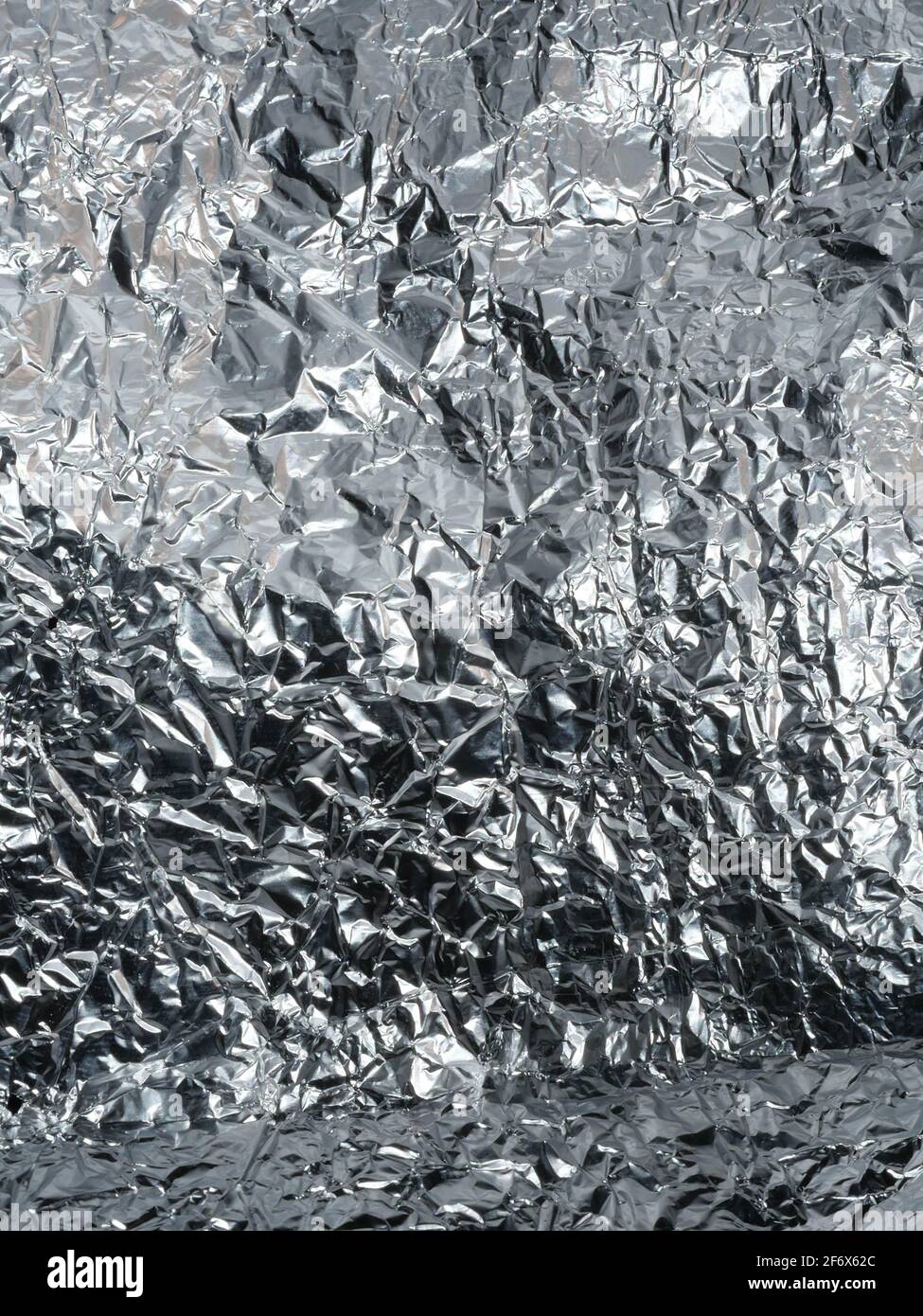 Thin sheet of silver leaf background with shiny uneven surface Stock ...