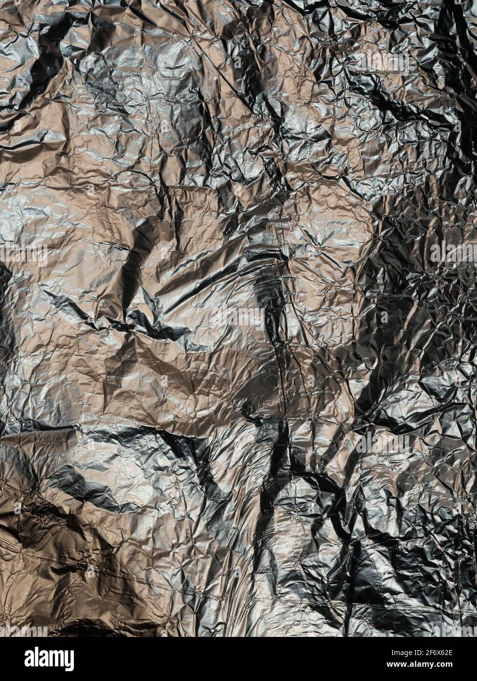 Thin sheet of silver leaf background with shiny uneven surface Stock ...