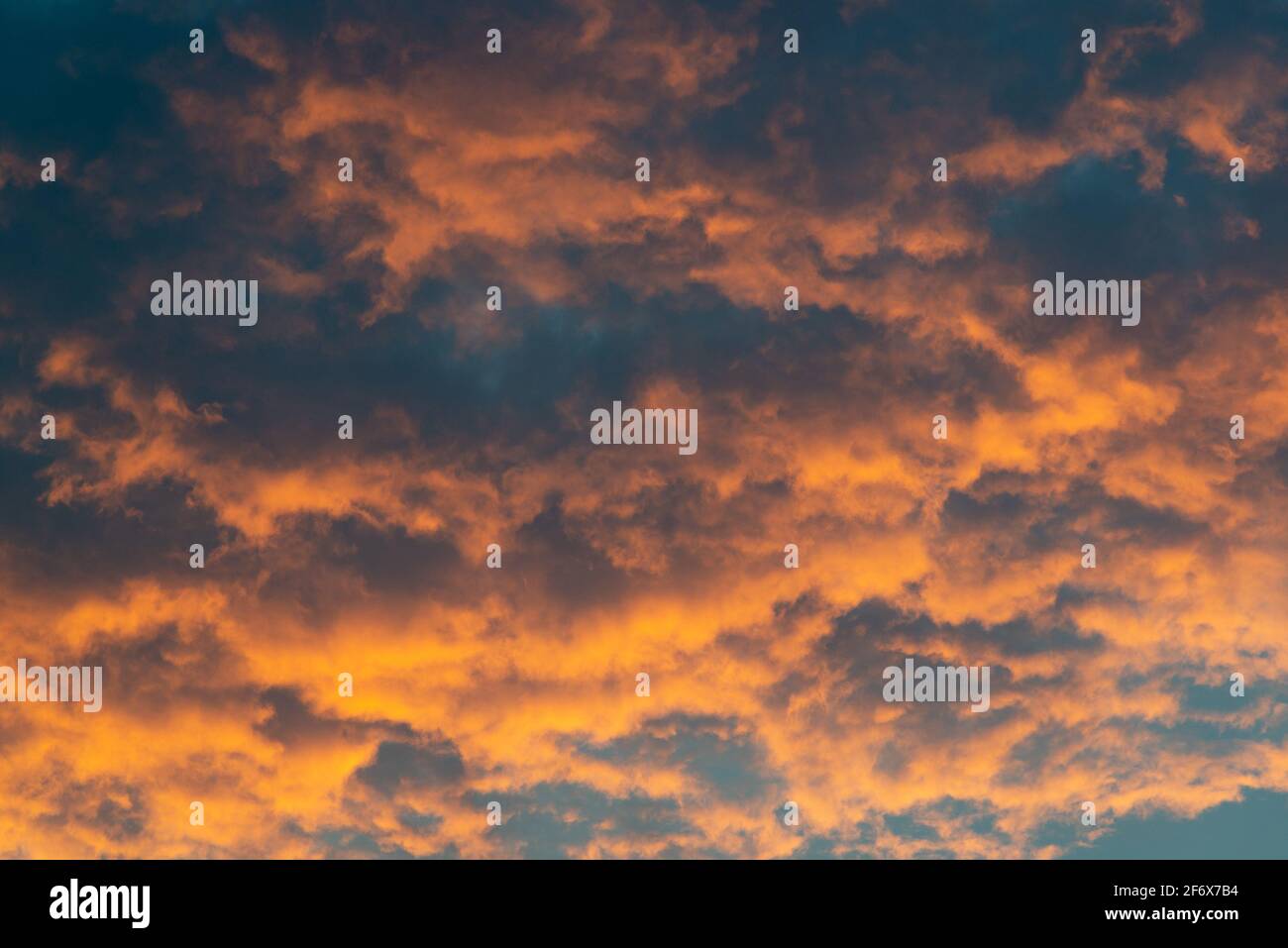 Beautiful sky landscape with yellow clouds at the sunset Stock Photo ...