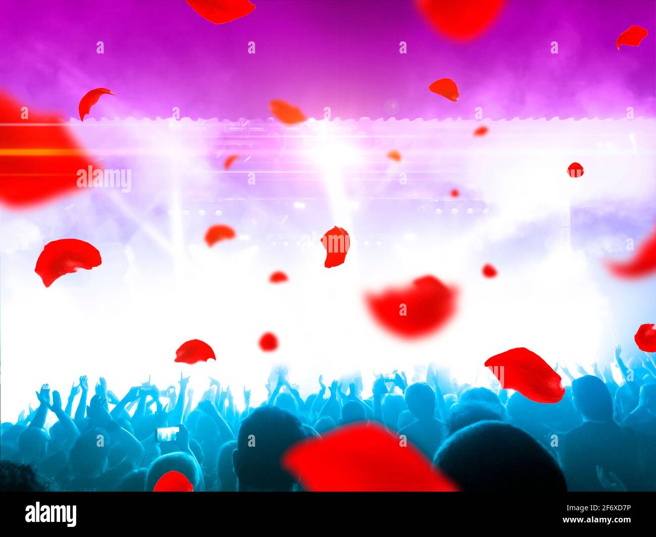 Large gathering of people in front of a lit stage Stock Photo - Alamy