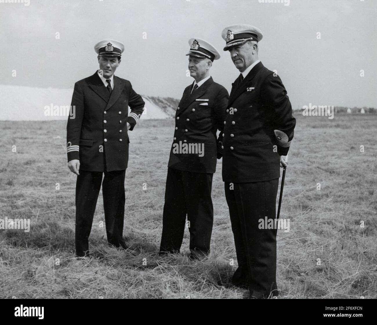 3 military people on meadow Stock Photo - Alamy