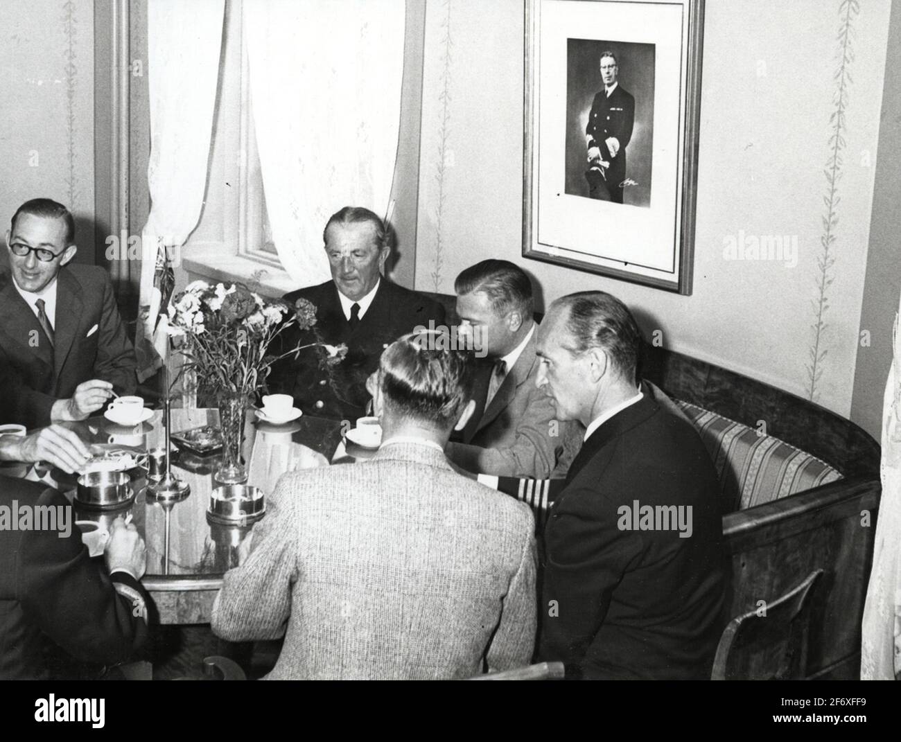 Men at coffee table Stock Photo - Alamy