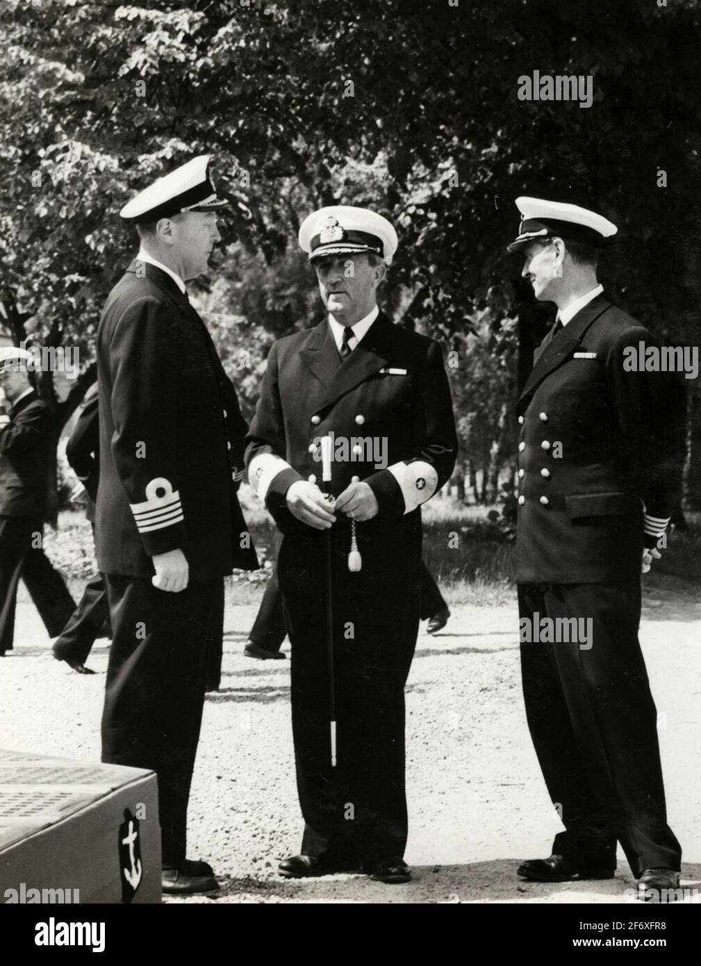 Three men in conversation Stock Photo - Alamy