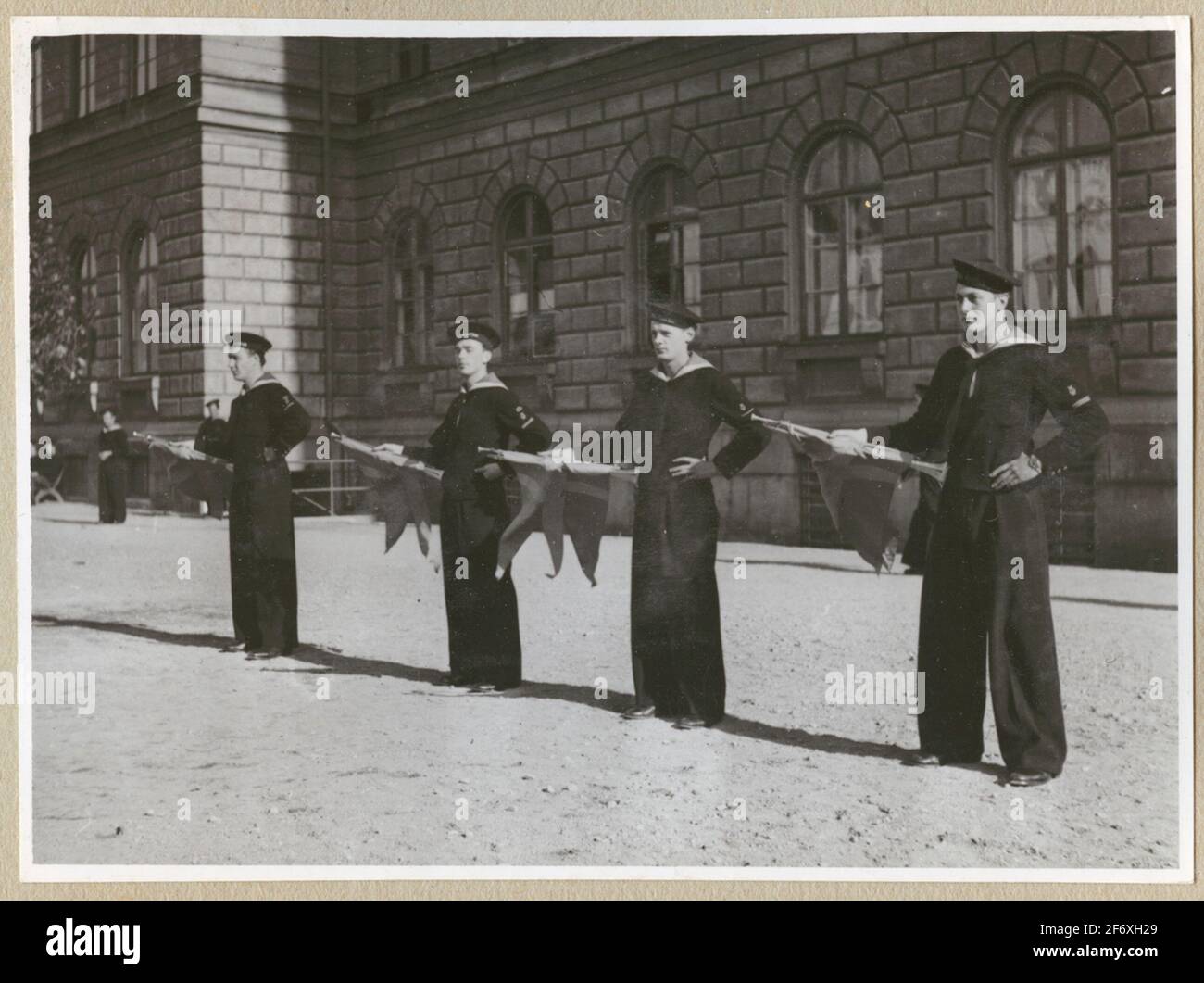 Seamen with flags Stock Photo - Alamy