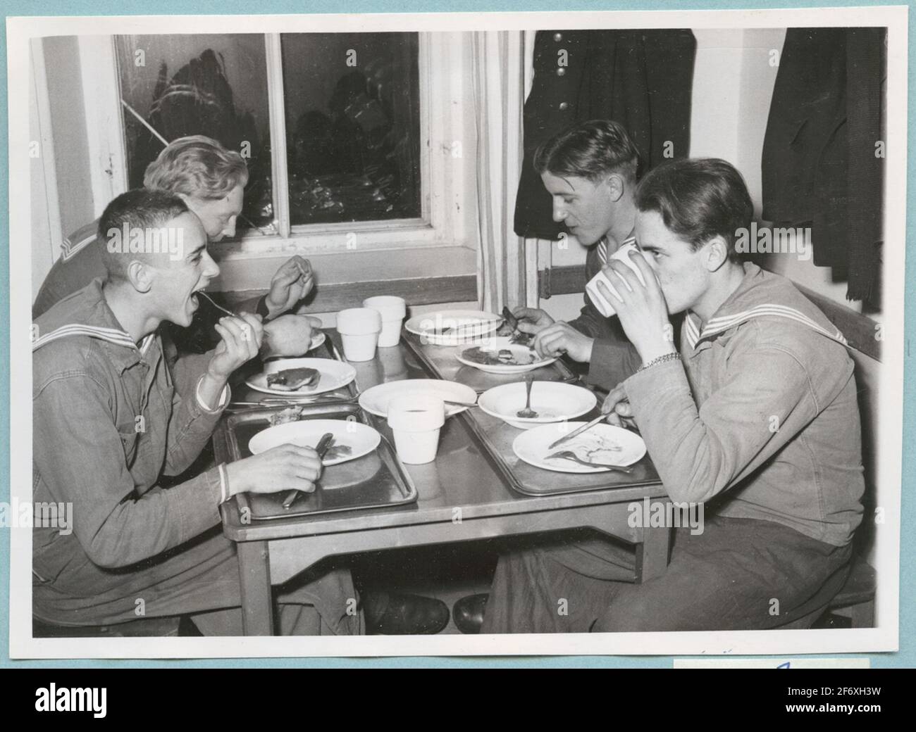 Men at dining table Stock Photo - Alamy