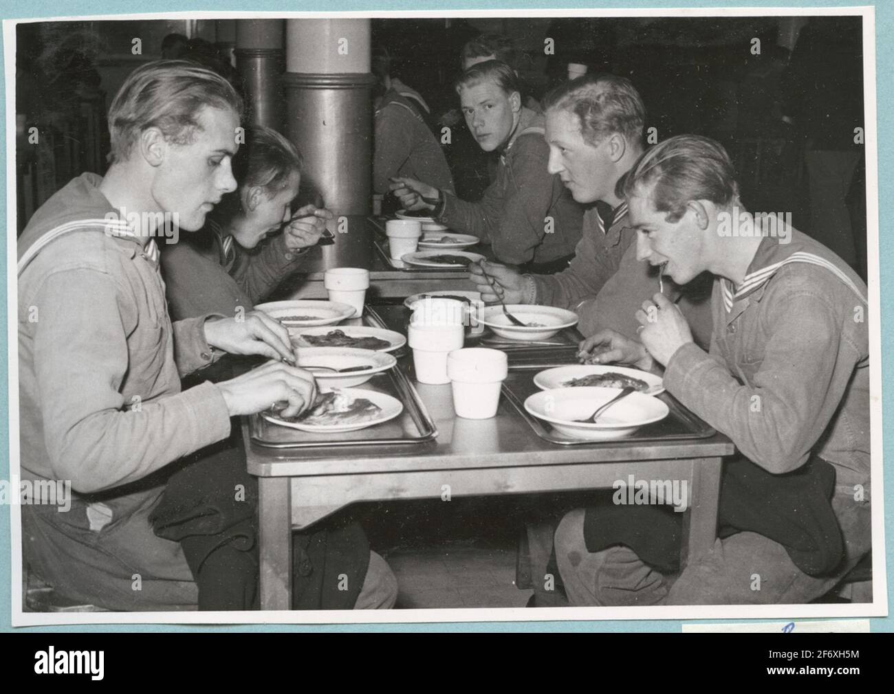 Men at dining table Stock Photo - Alamy