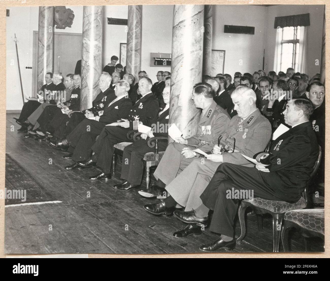 Military and civilians in the hall Stock Photo - Alamy