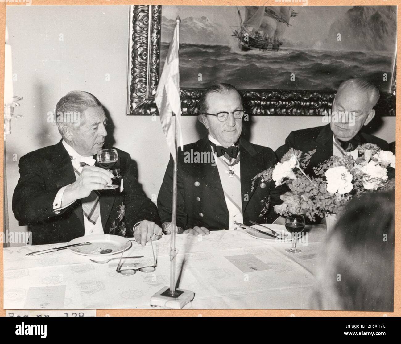 Men at dining table Stock Photo - Alamy