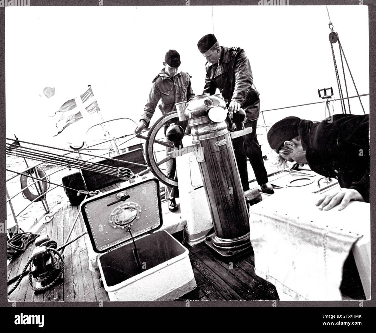 The picture shows three sailors on the stern ship of the school ship ...