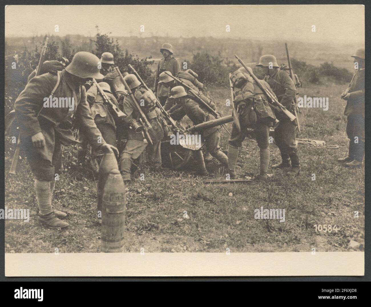 The picture shows a group of soldiers who bring an artillery in the ...