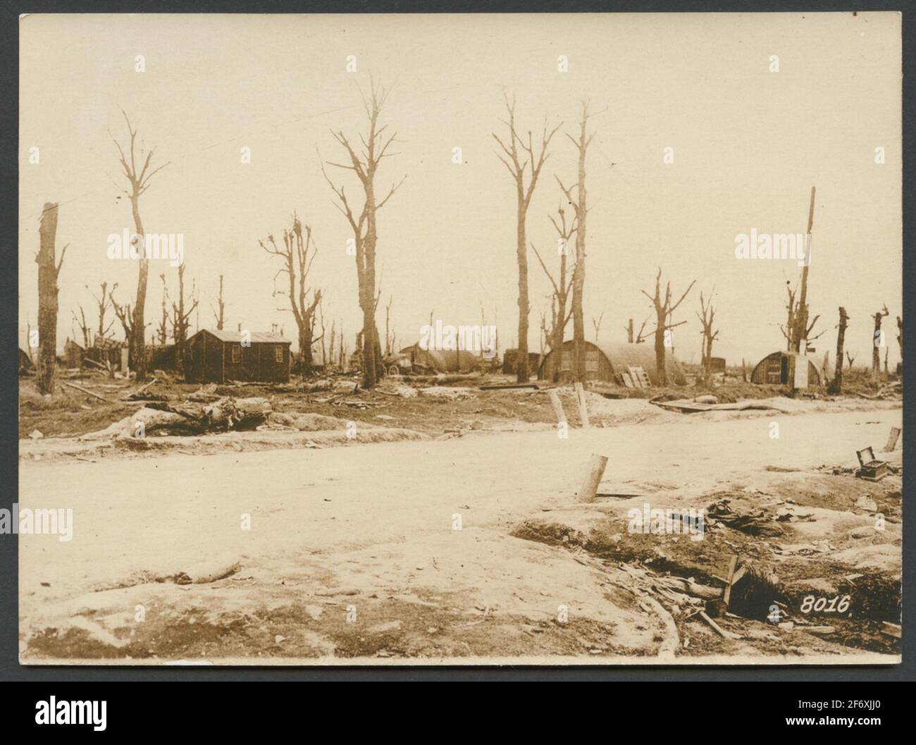 The picture shows a barrack camp at a country road. The picture shows a ...