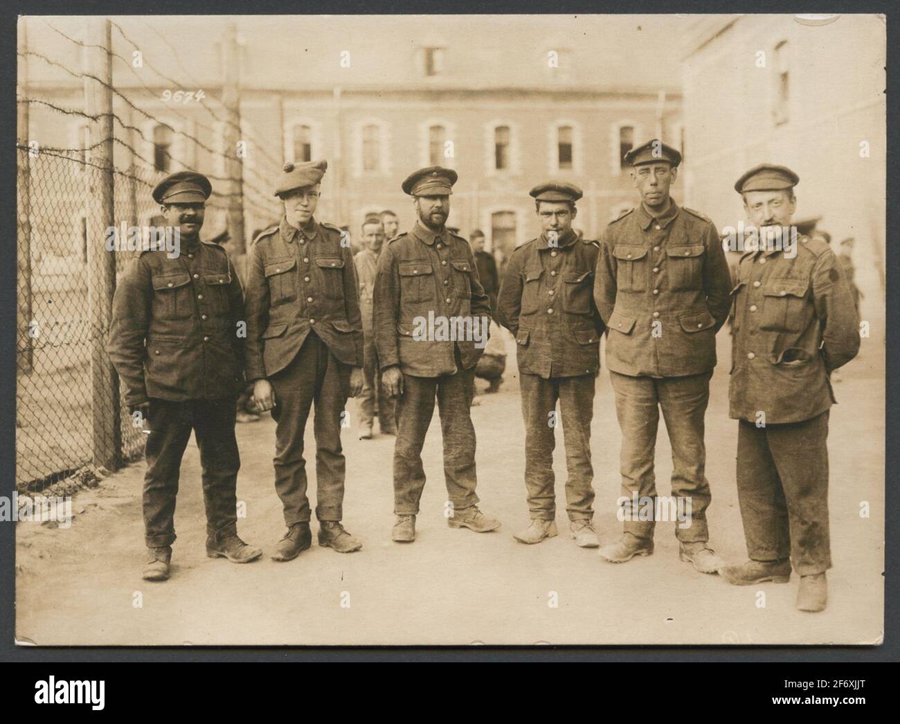 This group portrait shows six English prisoners in a prisoner who ...