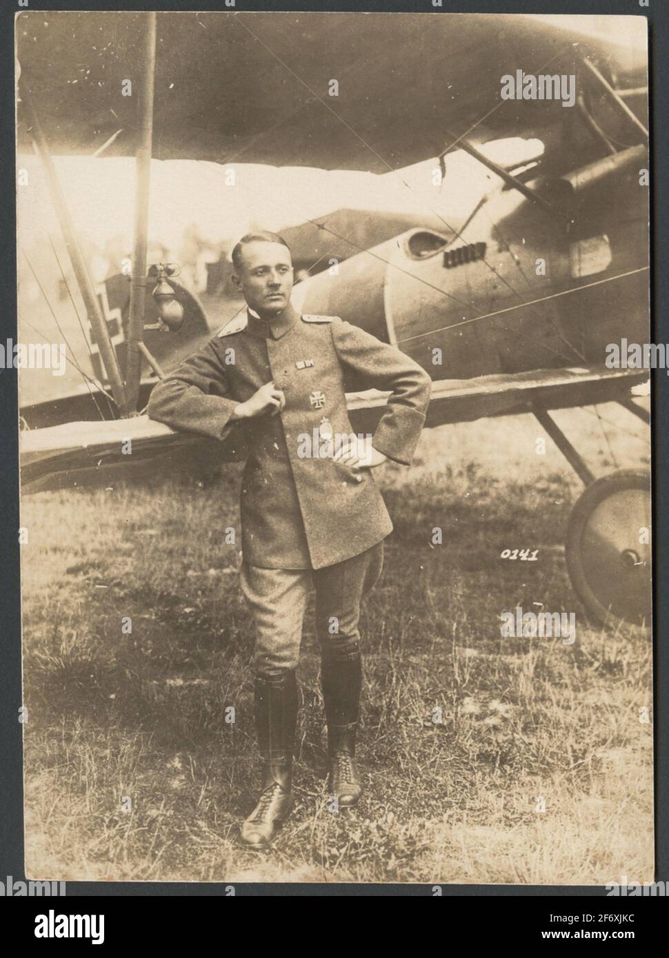 This portrait shows the German combat pilot Friedrich von Roth posing ...