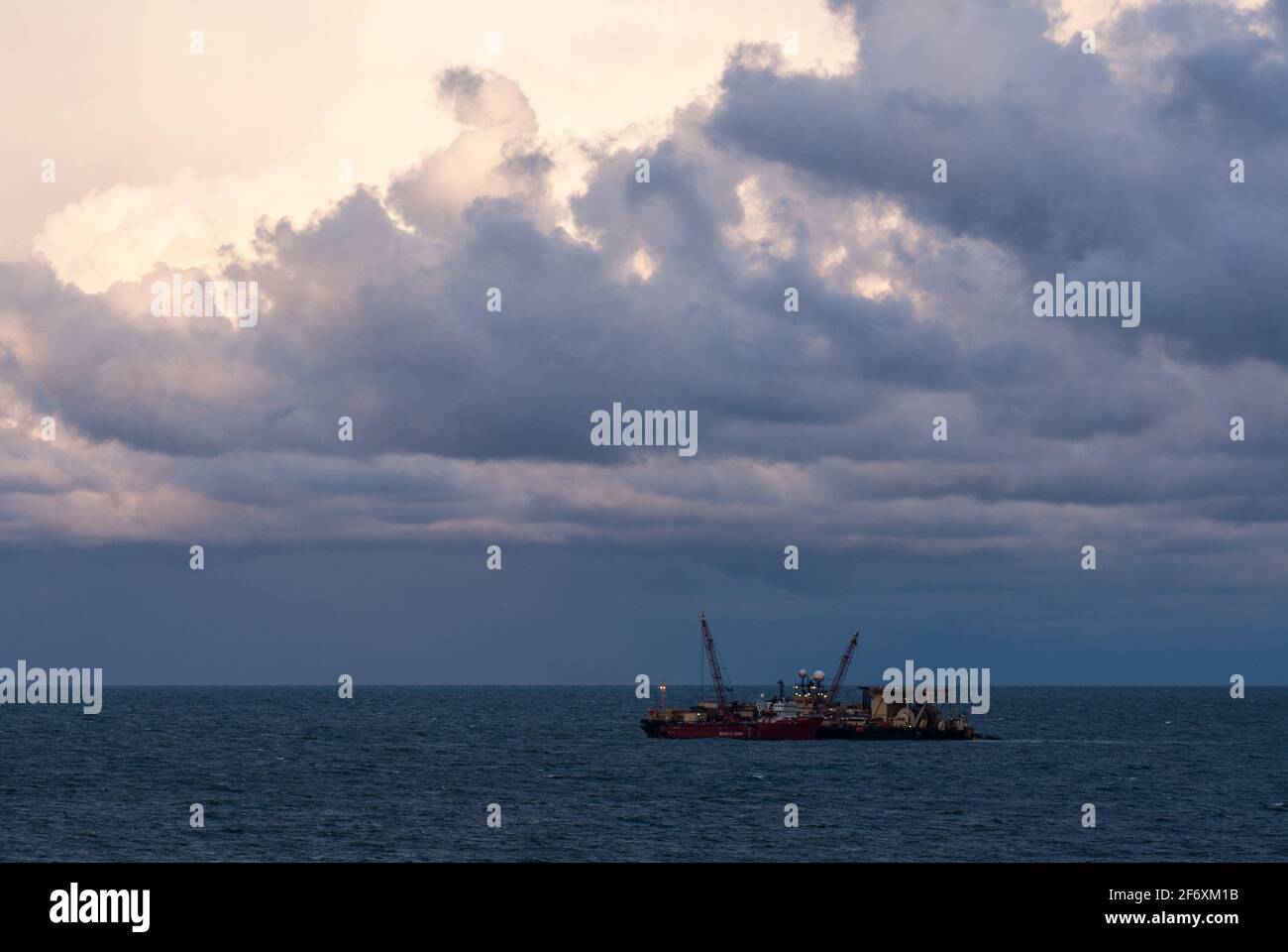 Dark clouds over a pipeline laying ship of the controversial Nordstream ...