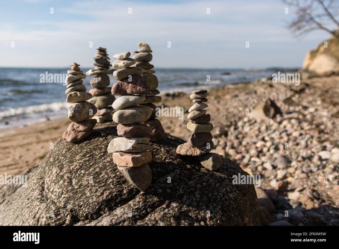 Stone piles at Nonnenloch beach in the Zicker hills of Ruegen Island ...