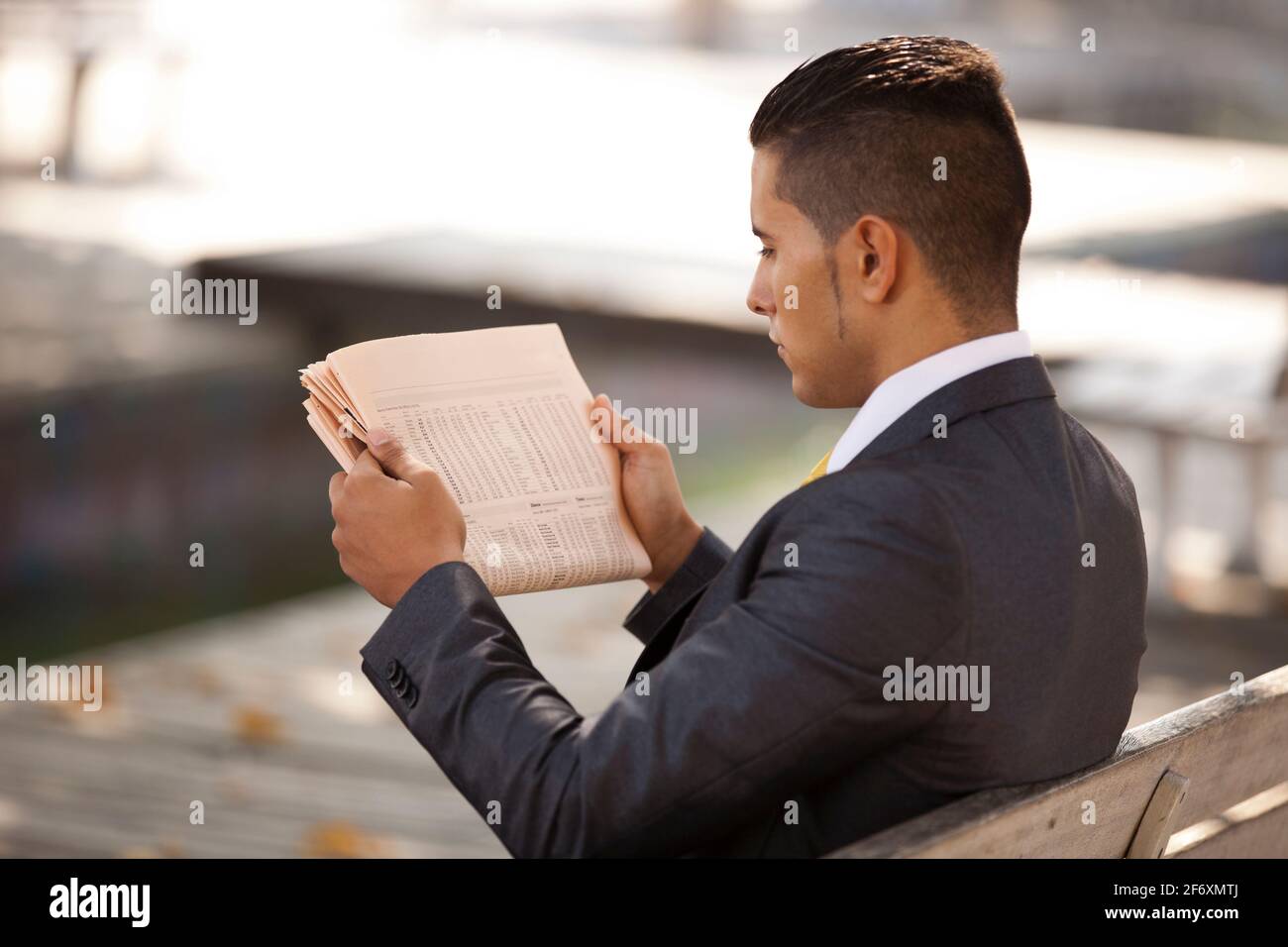 Businessman reading his newspaper next to his office building Stock ...