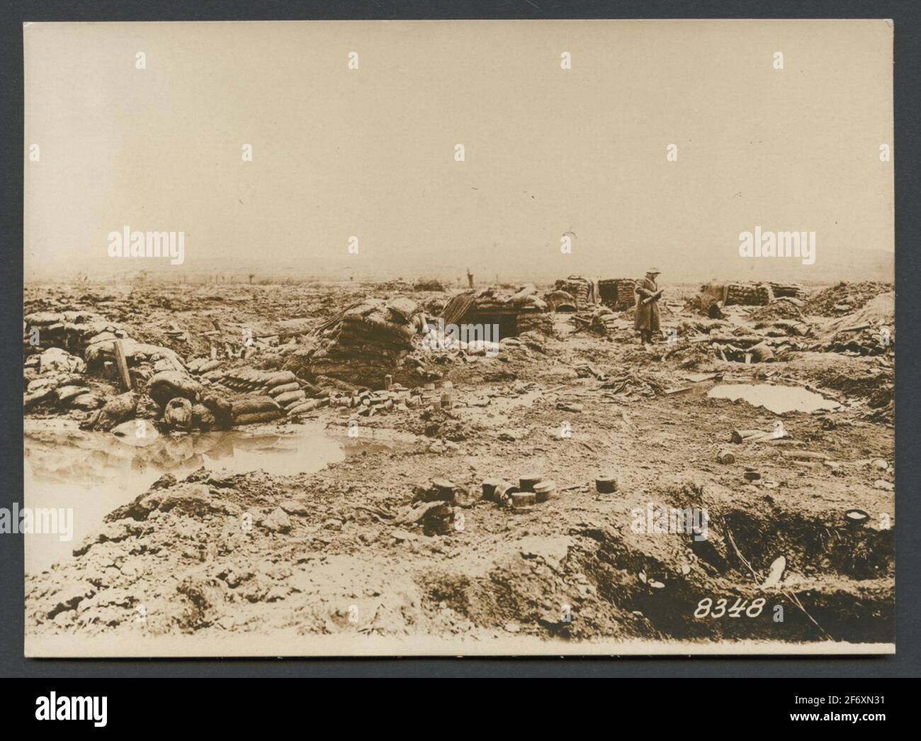 The picture shows a destroyed artillery stand on a muddy battlefield ...