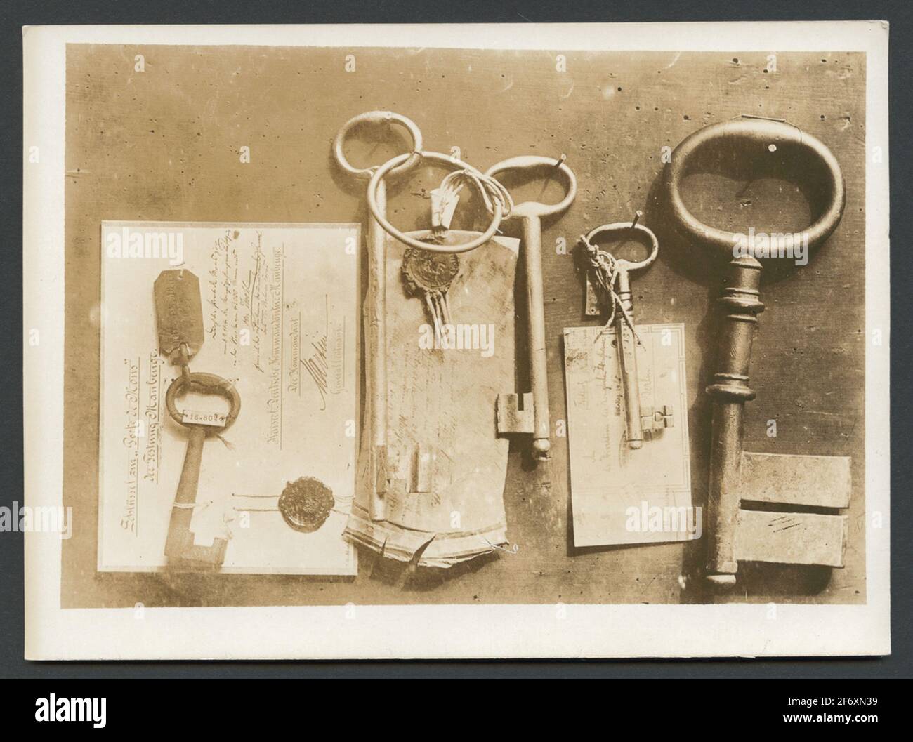 The image shows a plurality of keys that are partially attached to ...