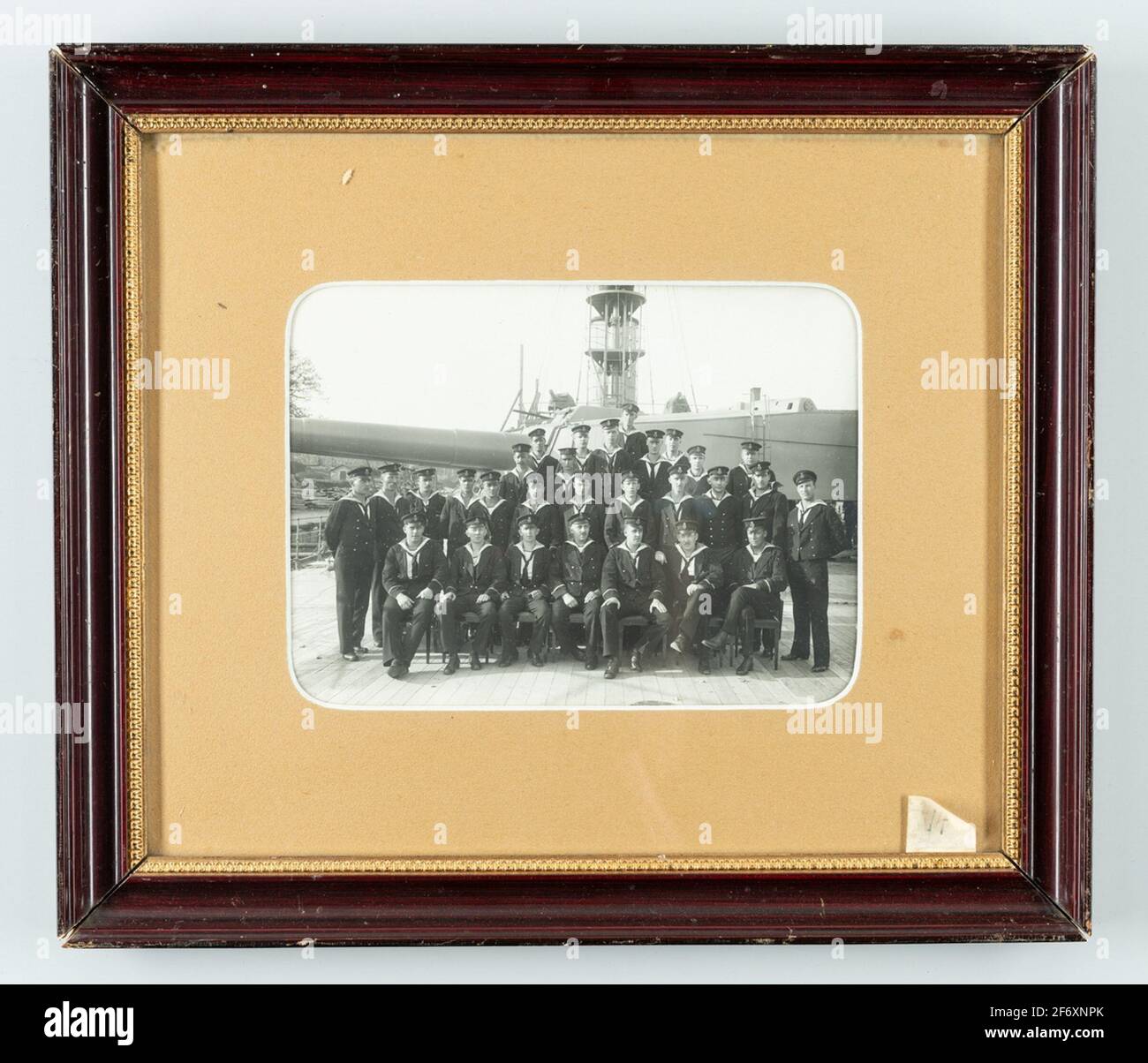 This group photo shows sub-officers on board an armor ship around 1920 ...