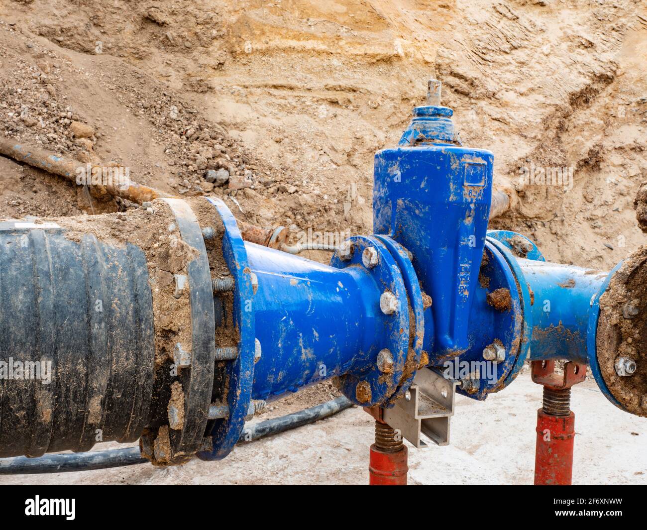 Large underground tubes and valves. Long water line downhill from water ...