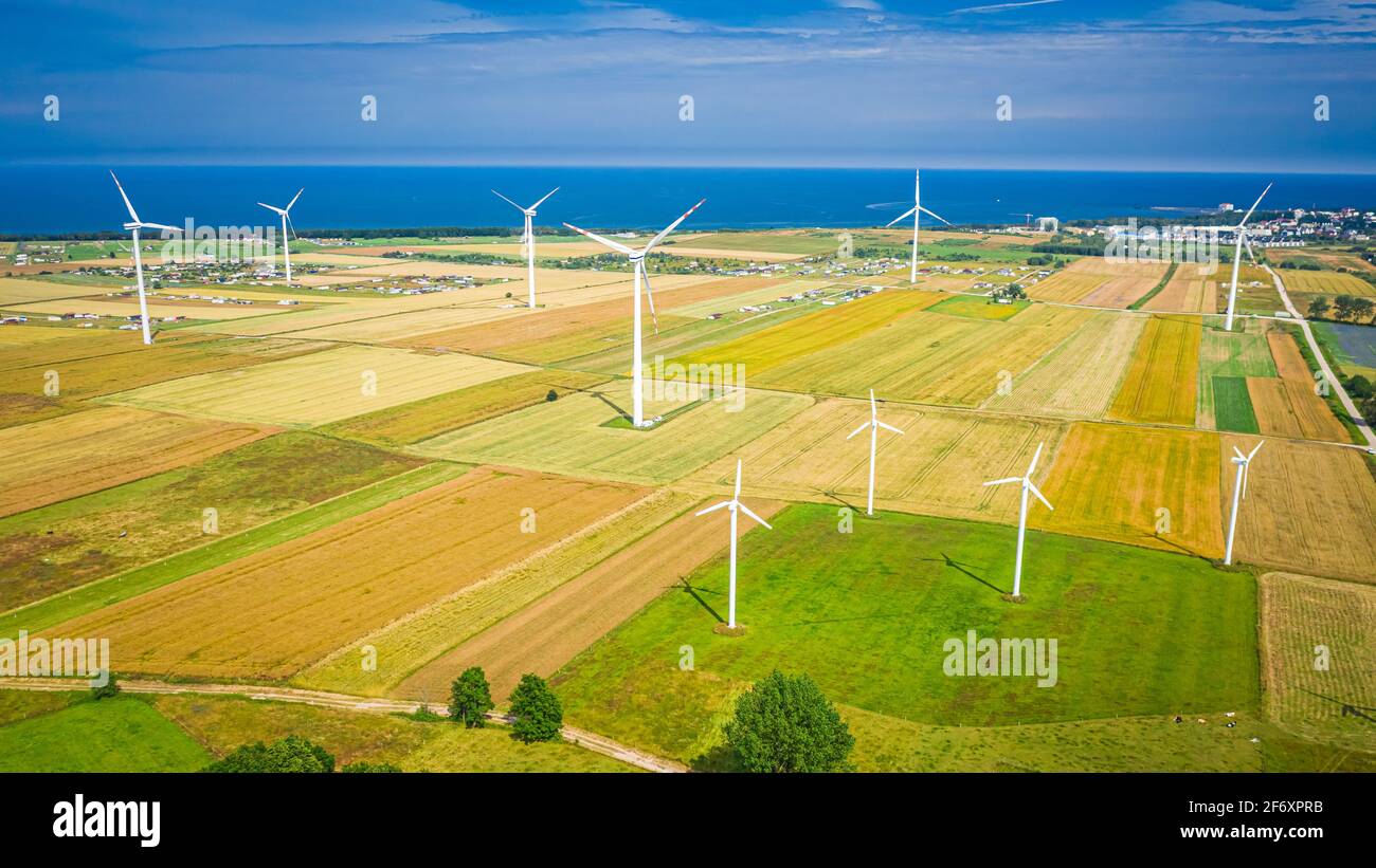 Big wind farm by Baltic Sea. Wind farm on field. Renewable energy in ...