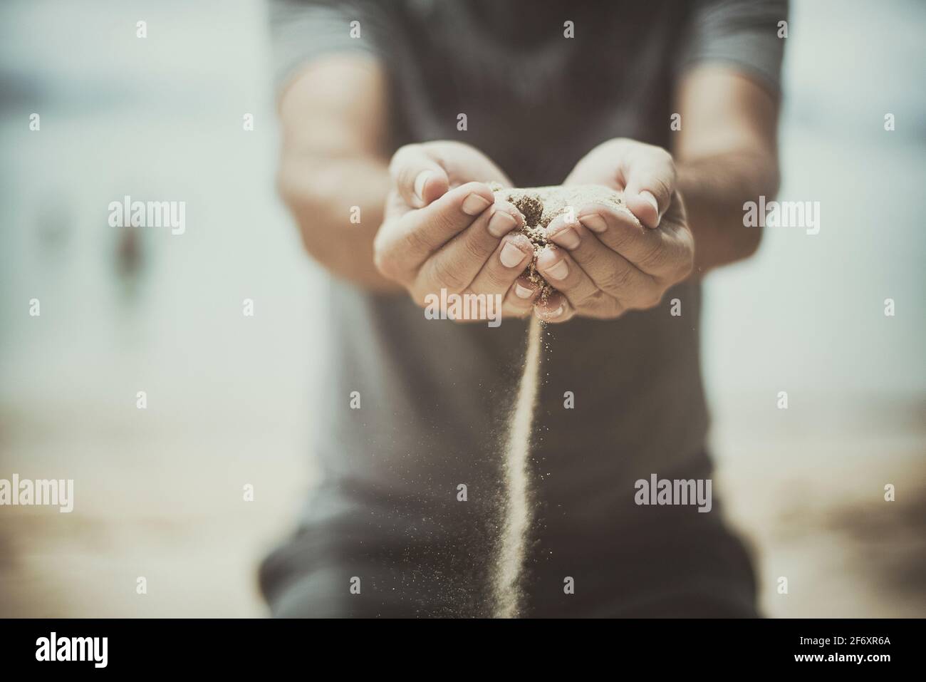 Sand Falling Through Hands High Resolution Stock Photography and Images ...