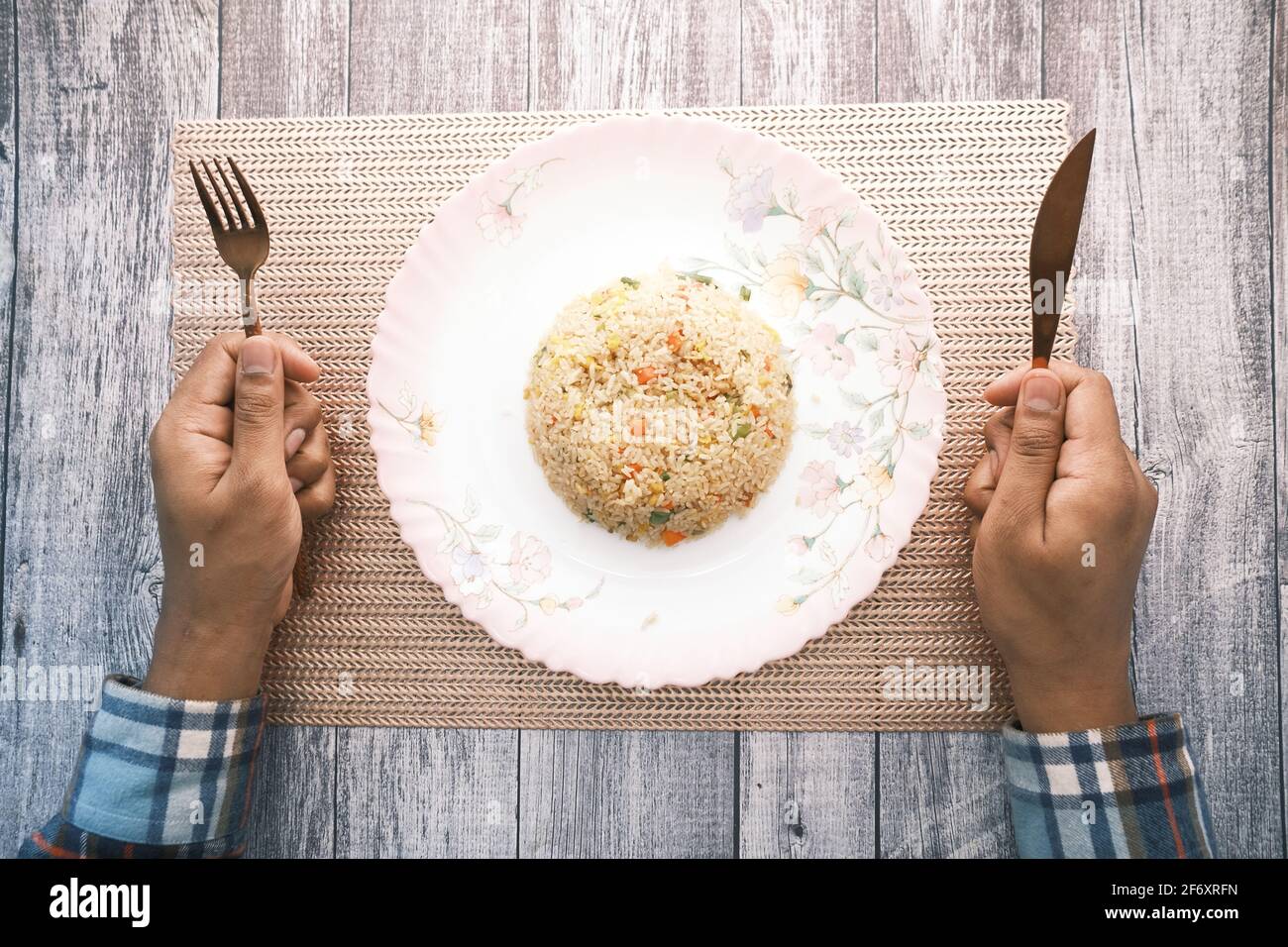 hand holding cutlery waiting for eating food Stock Photo - Alamy
