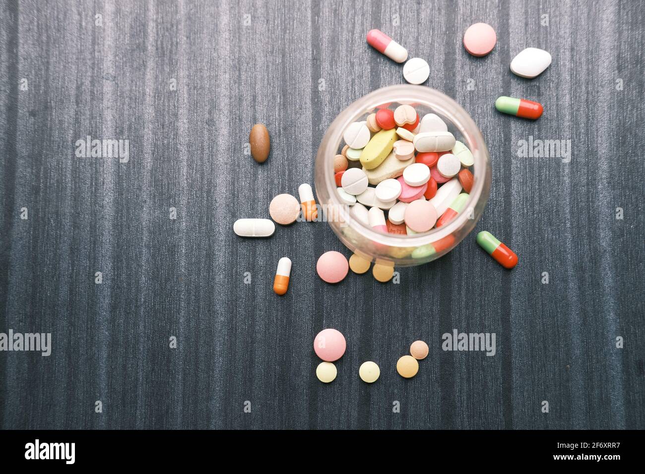 Close up pills capsule spilling hi-res stock photography and images - Alamy