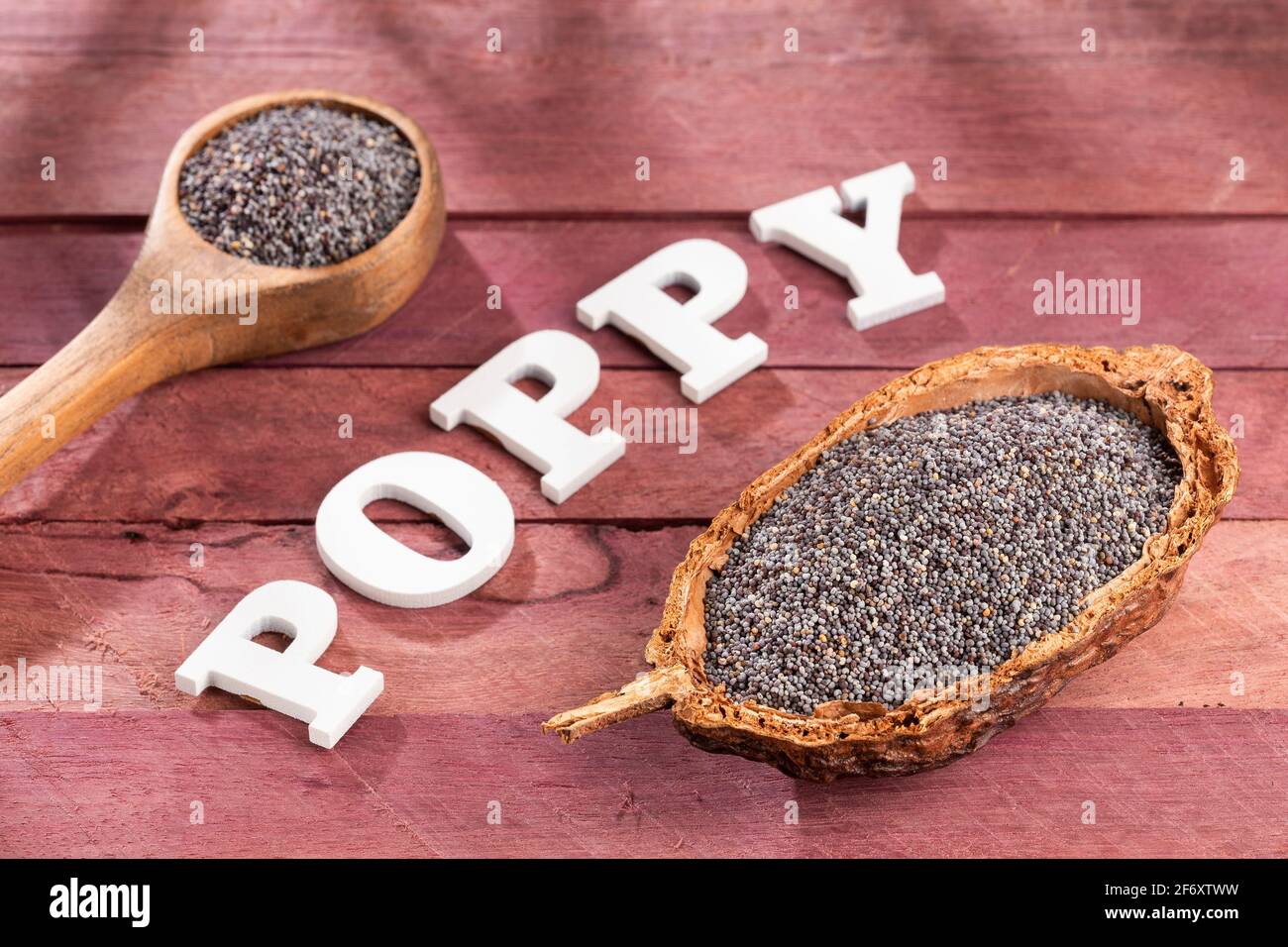 Organic poppy seeds - Papaver somniferum. The word poppy in letters ...
