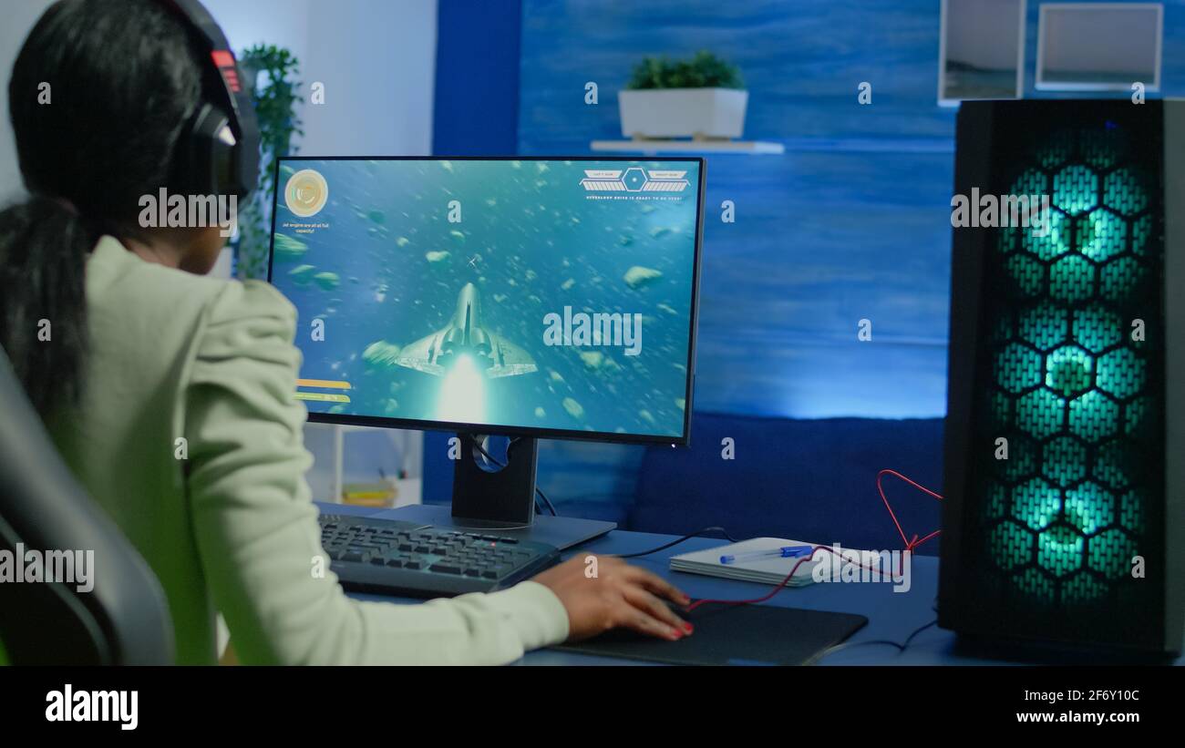 Addicted african video gamer performing cyber video games using ...