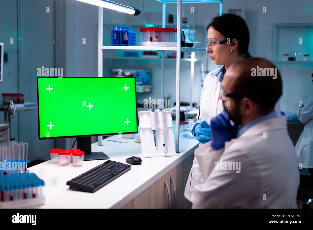 Modern medical research laboratory with two scientists using computer ...
