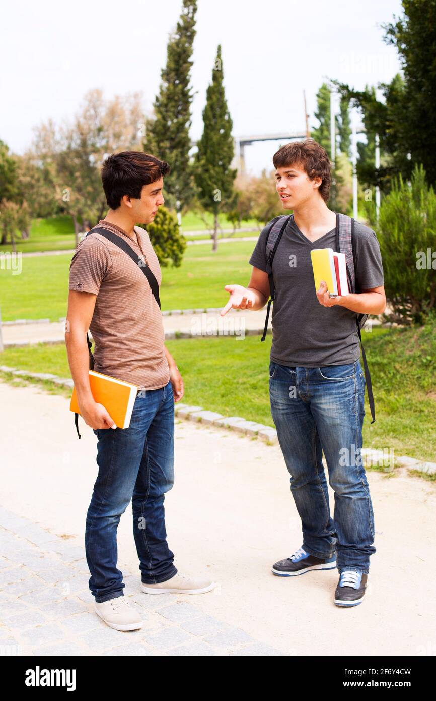 Two boys talking campus hi-res stock photography and images - Alamy