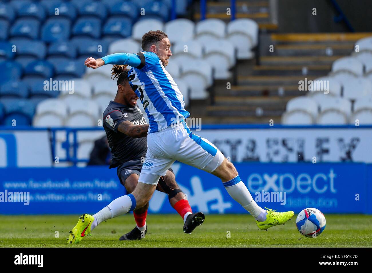 Huddersfield, UK. 03rd Apr, 2021. Ivan Toney #17 of Brentford shoots at ...