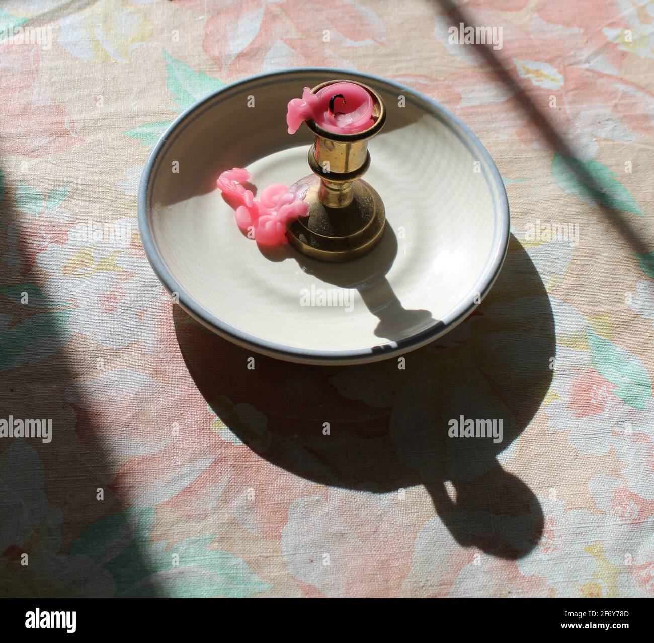 Melted Pink Candle on a Candlestick Stock Photo - Alamy