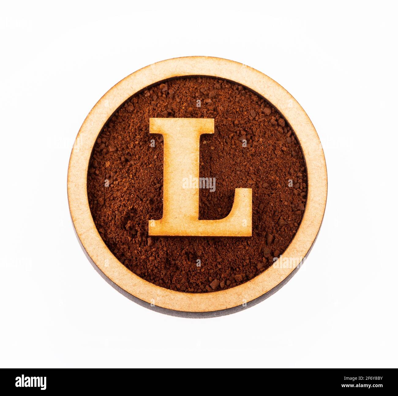 L, wooden alphabet letter - Ground organic coffee. Coffea Stock Photo ...