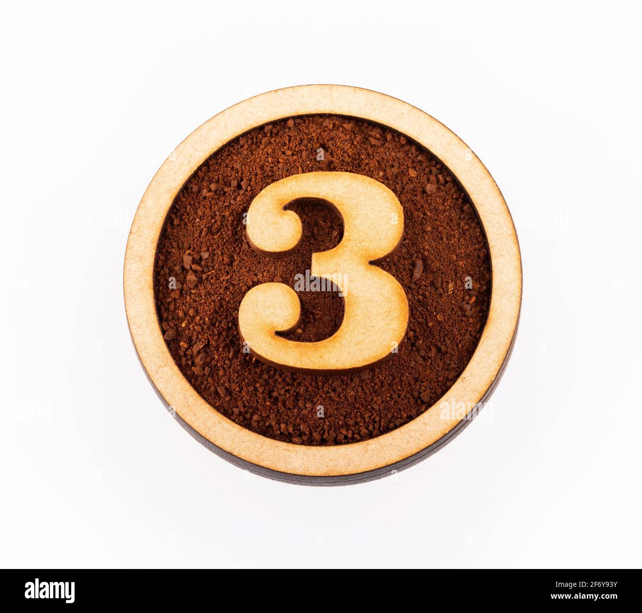 3, Number in wood - Ground organic coffee. Coffea Stock Photo - Alamy
