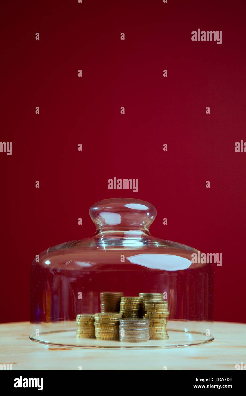 Money protected inside a glass shield Stock Photo - Alamy