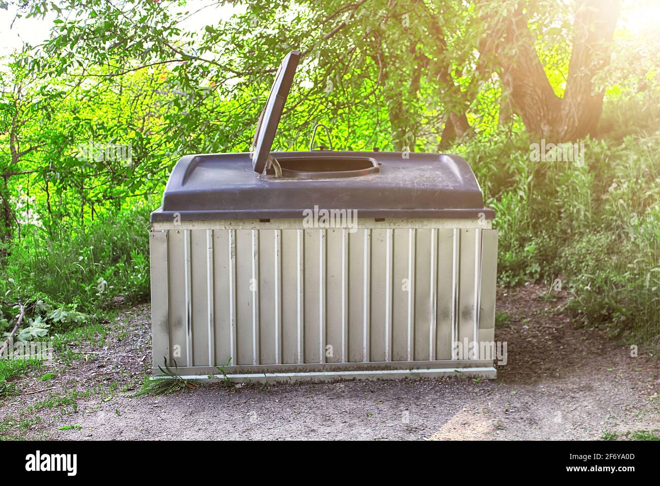 Large metal container for garbage in the park Stock Photo - Alamy